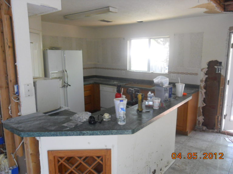 Surf Green Granite for a Kitchen Peninsula | Granite Austin Texas